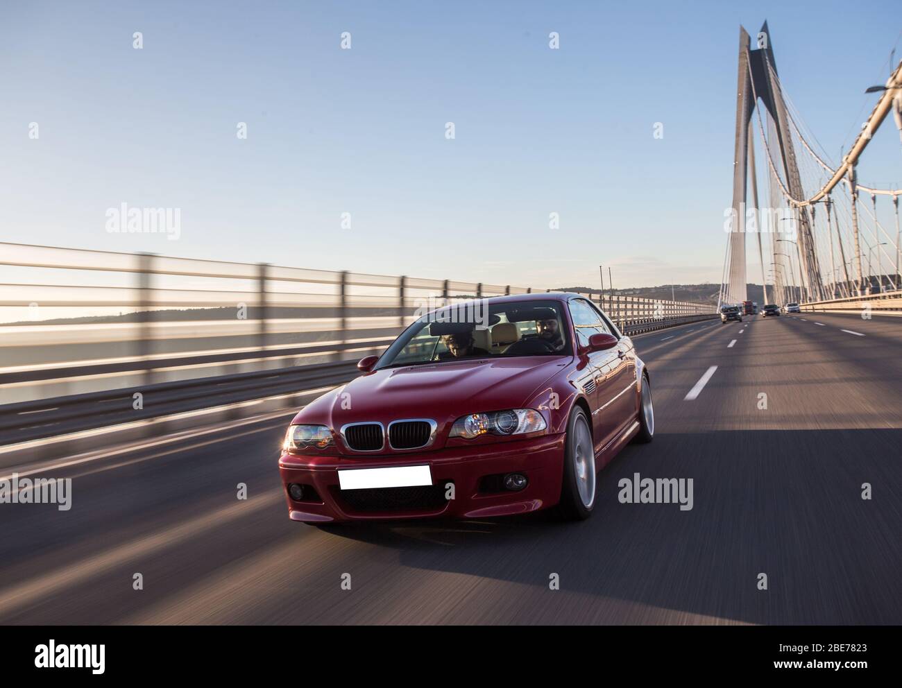 Red vintage model sedan car over the bridge Stock Photo - Alamy