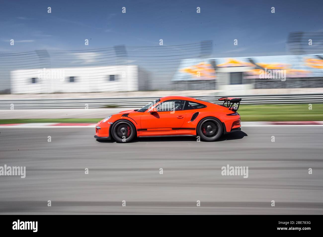Red sport racing car on the highway Stock Photo - Alamy