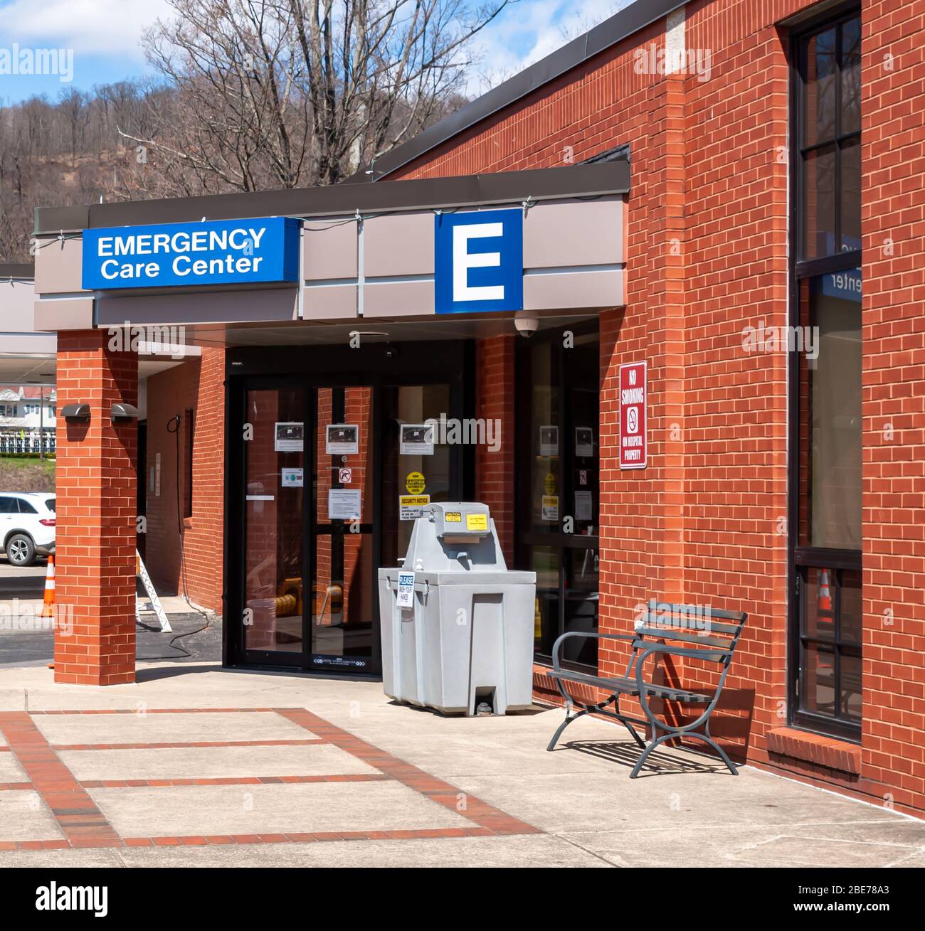 The entrance to the emergency room with a hand washing station next to ...