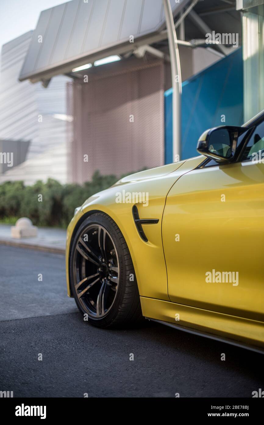 Yellow sport car,front black wheel and door Stock Photo - Alamy