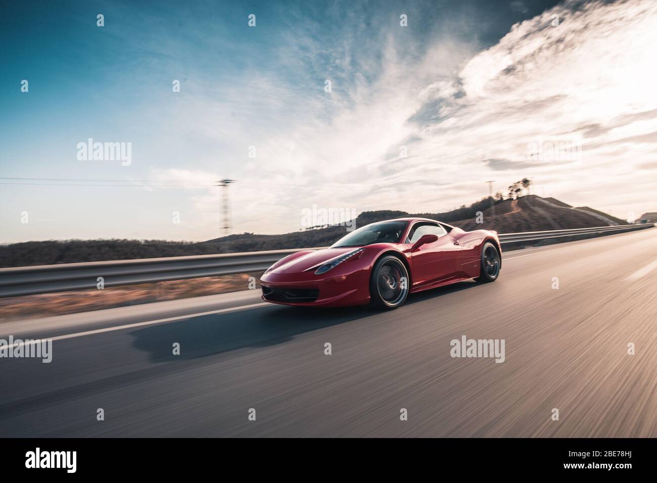 Red luxury sport car with red lights high speed driving Stock Photo - Alamy