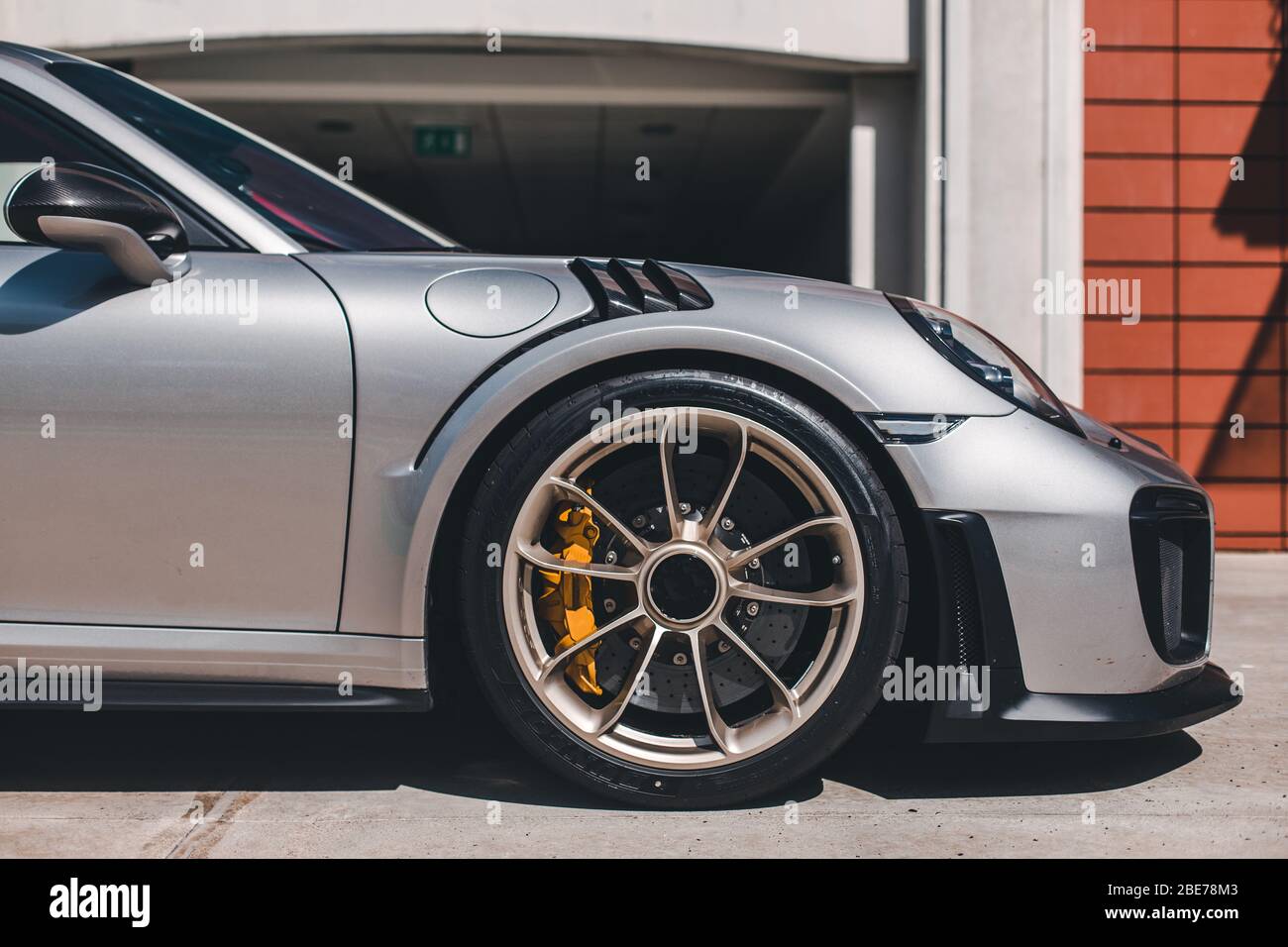 Silver sport car with black autotuning,front lights and wheel Stock ...
