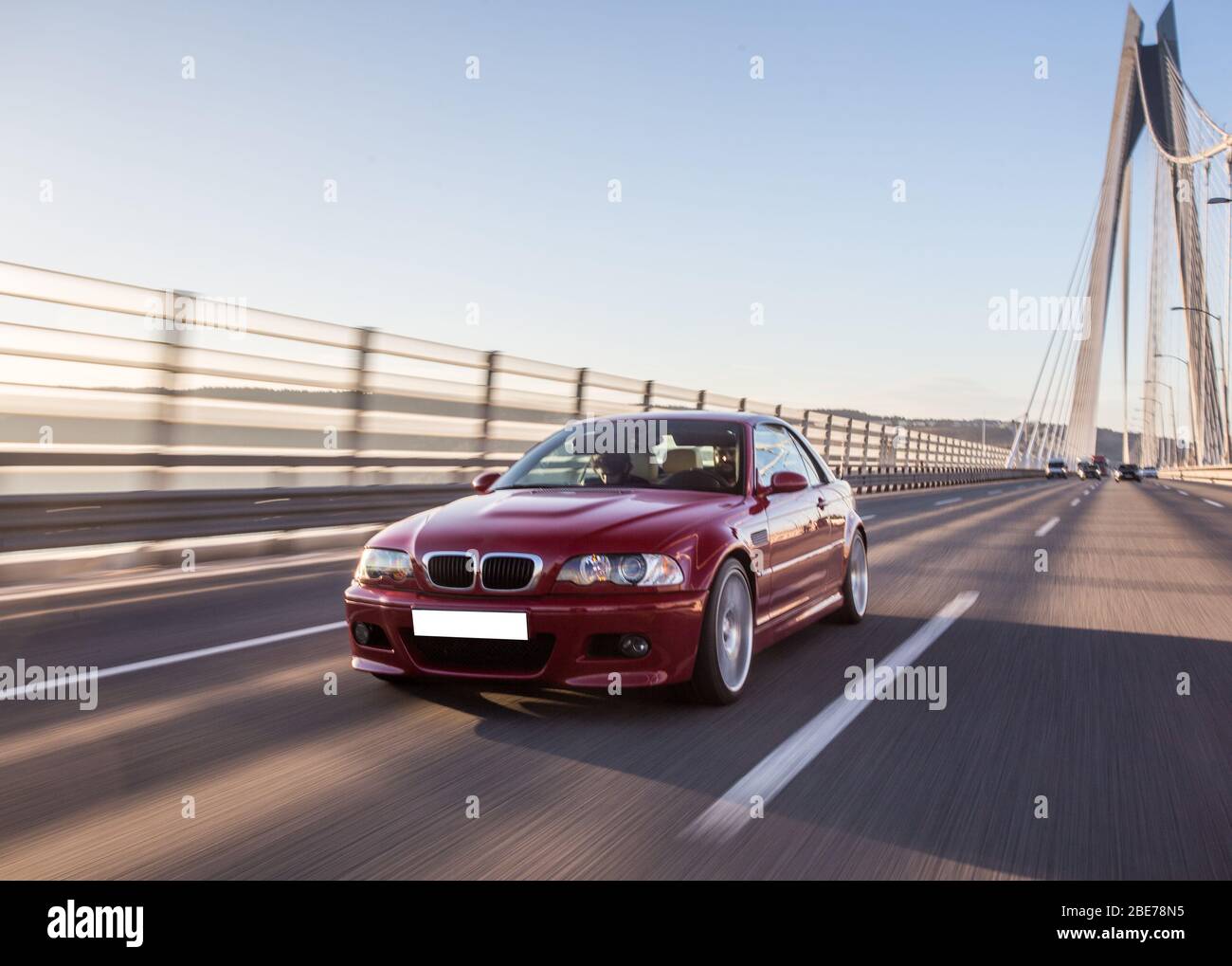 Red vintage model sedan car over the bridge,front view Stock Photo - Alamy