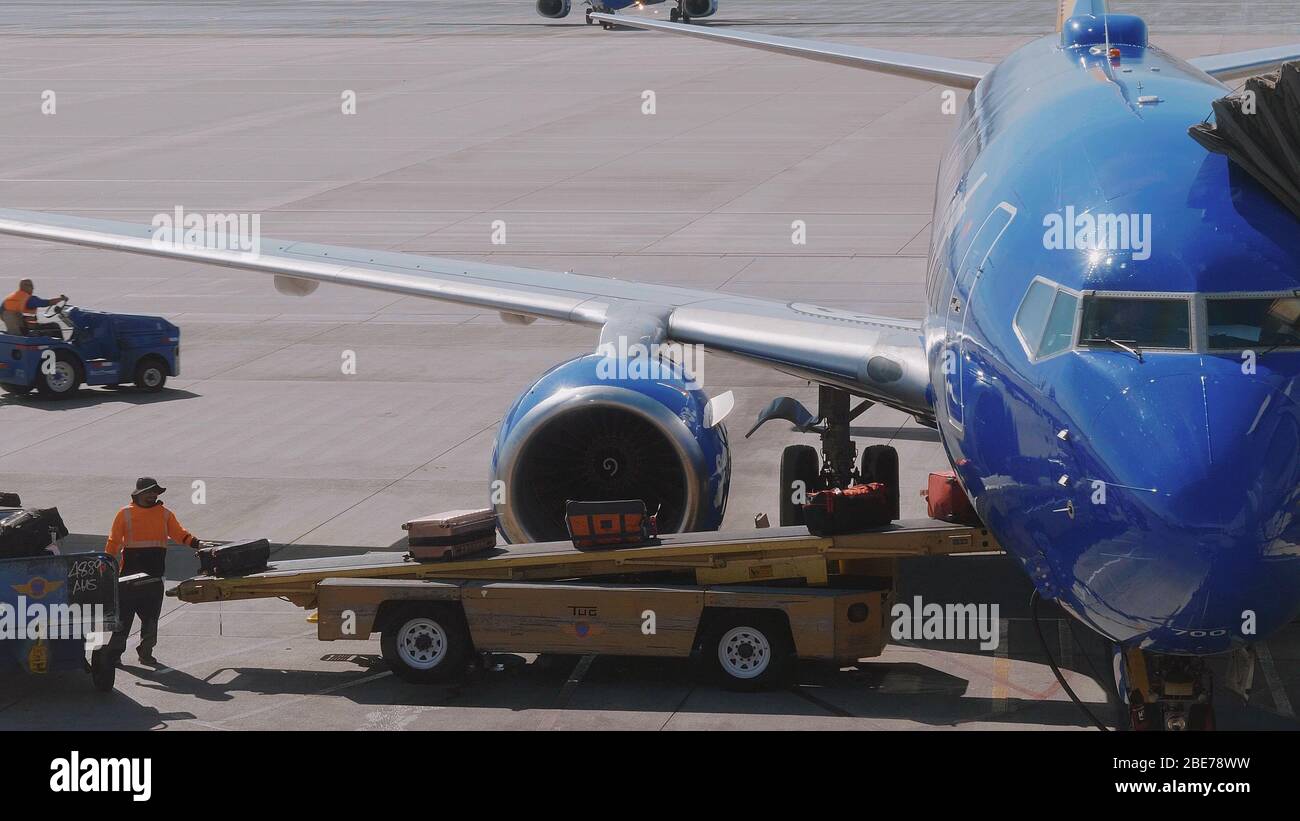 Loading baggages airplane gate las hi-res stock photography and images ...
