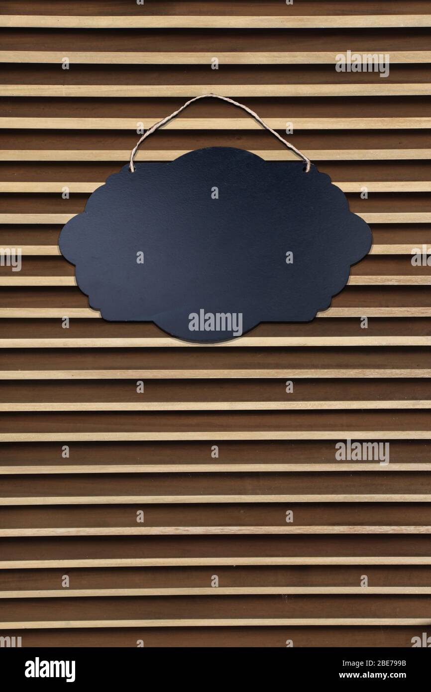 Black Empty Sign Board with string for hanging on wall Stock Photo - Alamy