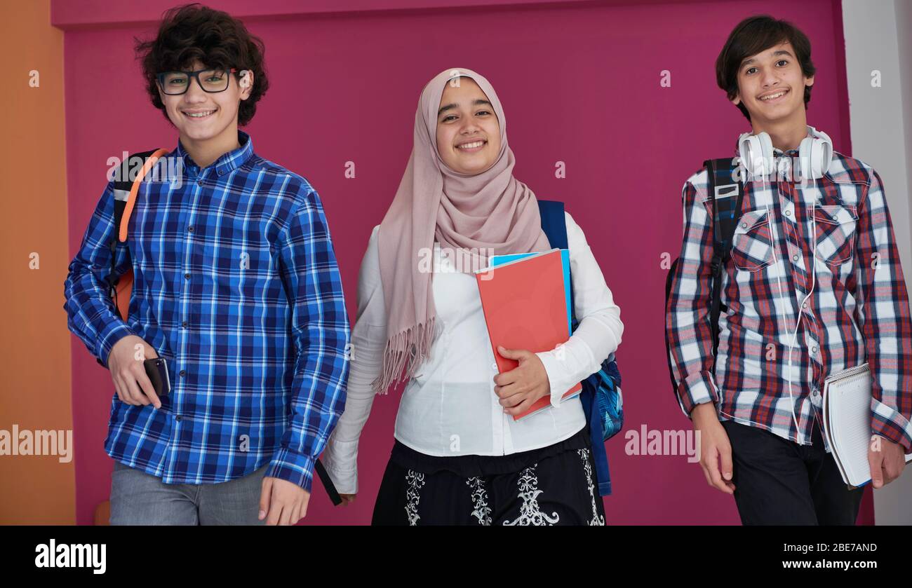 Arabic teenagers group, students team walking forward in future and ...