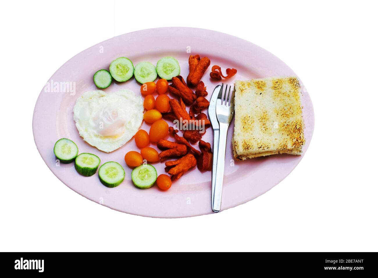 Breakfast set in pink plate isolated on white background Stock Photo ...