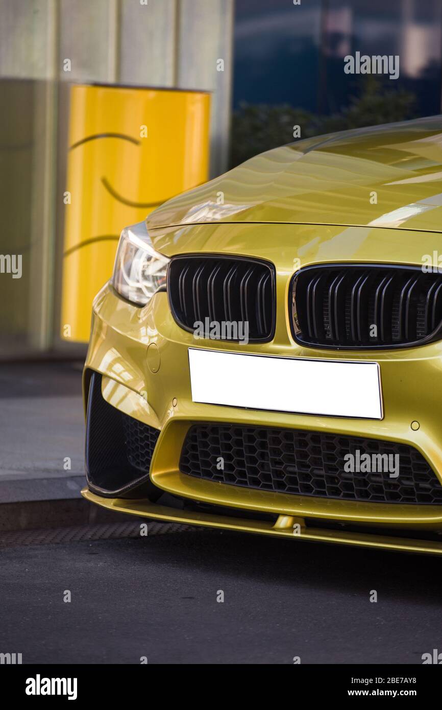 Yellow sport model car,front bumper and xenon lights Stock Photo - Alamy