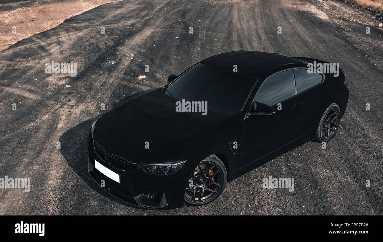 Velvet black car in the road parking, upside view Stock Photo - Alamy
