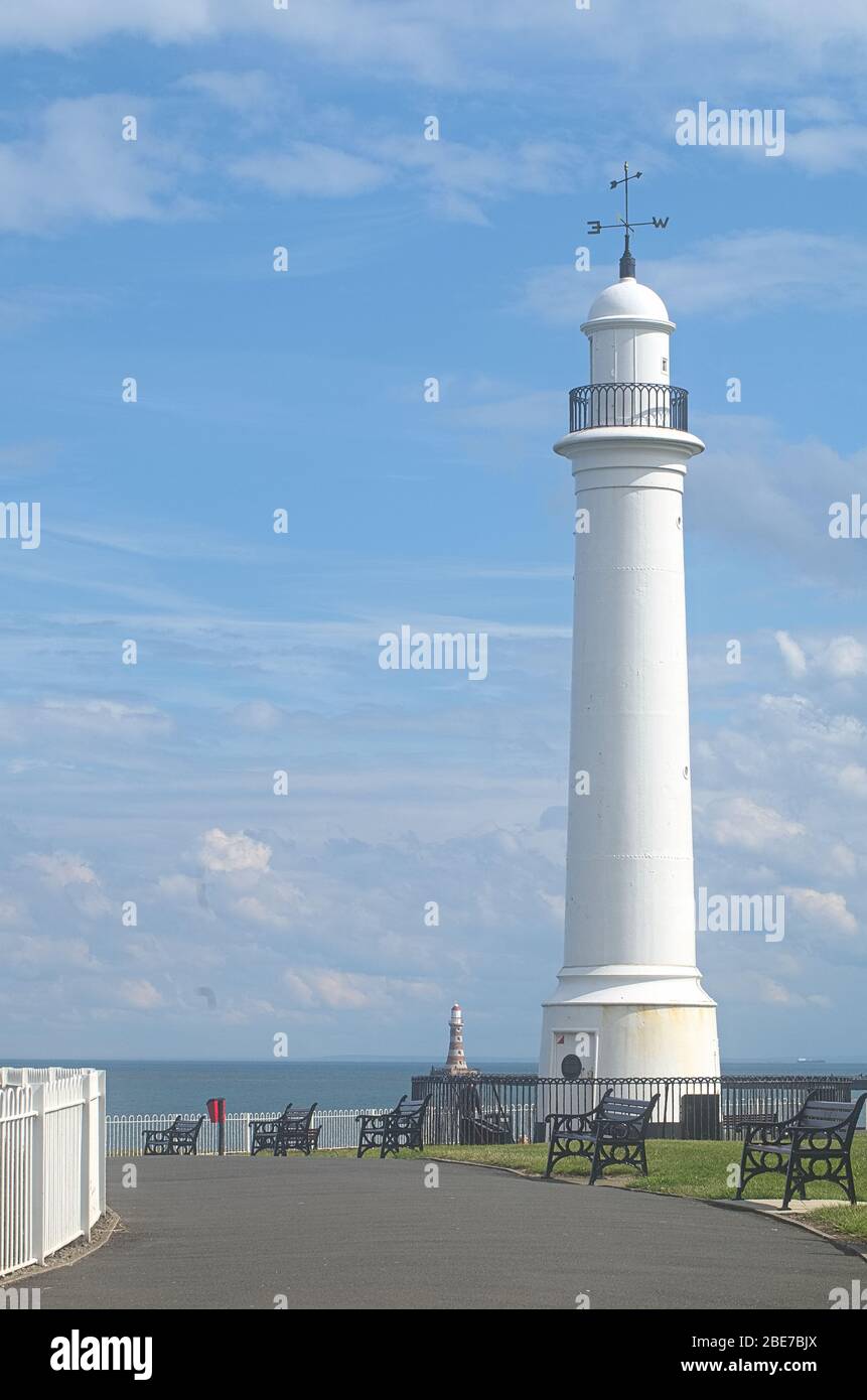Lighthouse and park benchese along the promenade at Seaburn in the ...