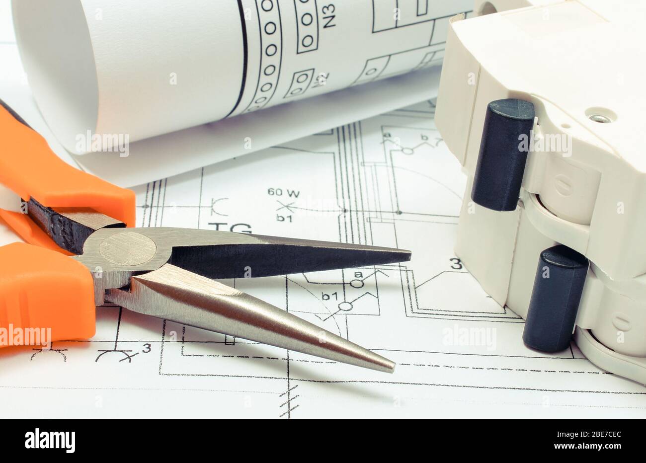 Electrical diagrams, electric fuse and metal pliers on construction ...