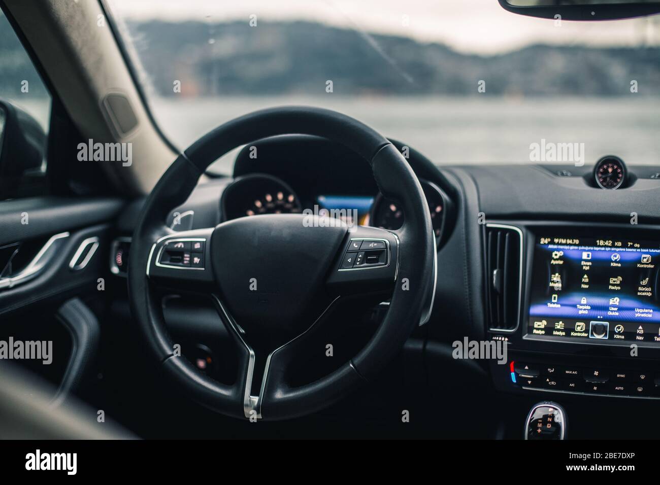 Interior, control wheel of a black car Stock Photo - Alamy