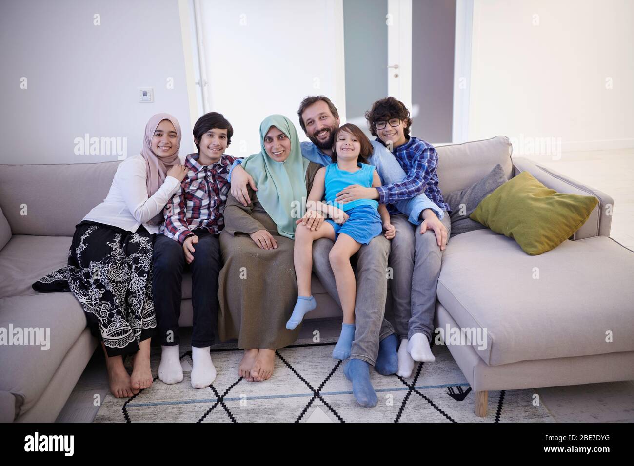muslim family portrait with arab teenage kids at modern home interior ...