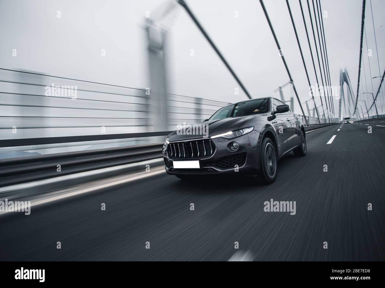 Black offroader high speed drive on the bridge Stock Photo - Alamy