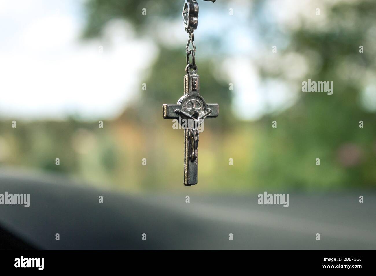 Hanging chain with a crucifix Stock Photo - Alamy