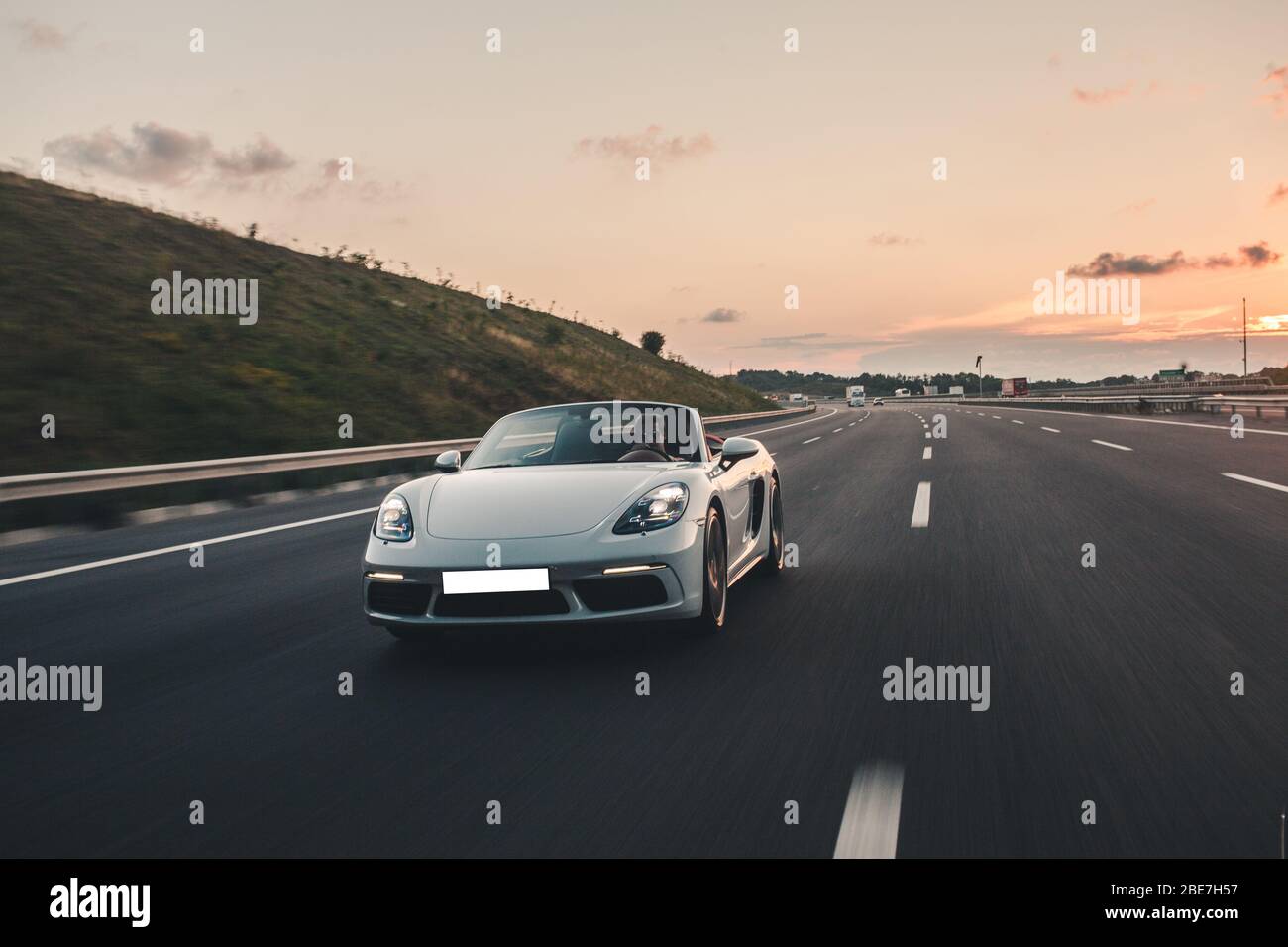 White super model cabriolet car driving on the highway,front view Stock ...