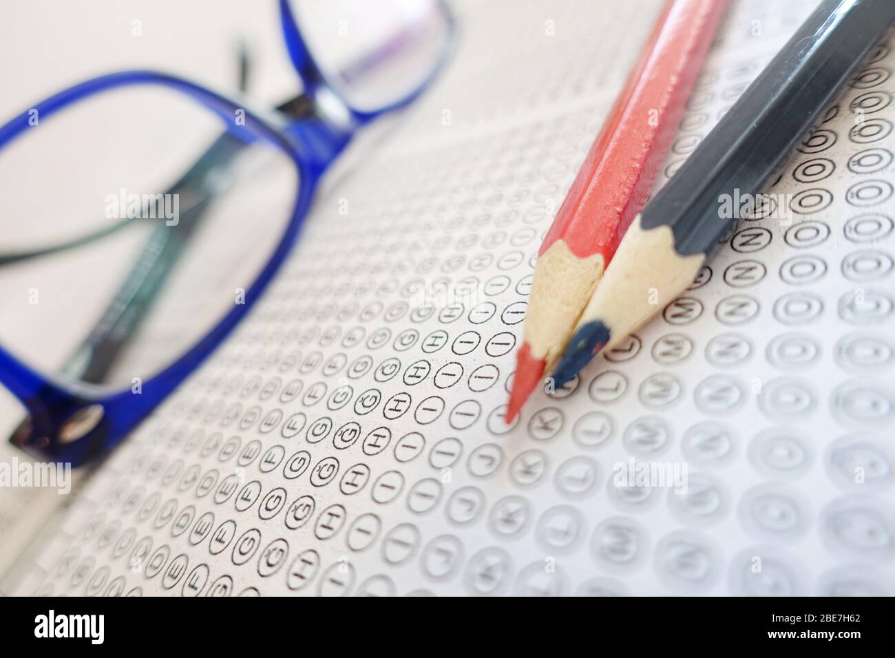 Pencil and glasses on answer sheet- test exam Stock Photo - Alamy