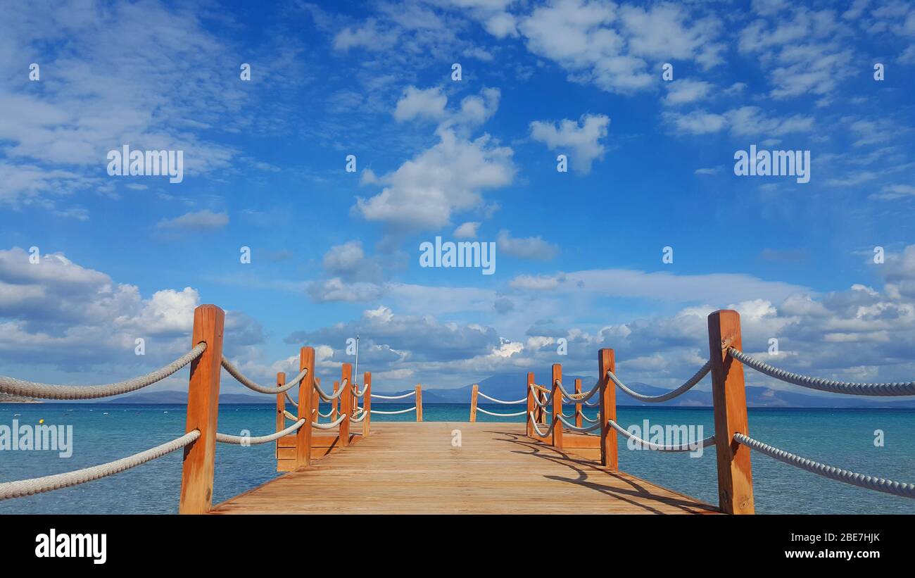 Tropical beach and pier in Cesme in Turkey Stock Photo - Alamy