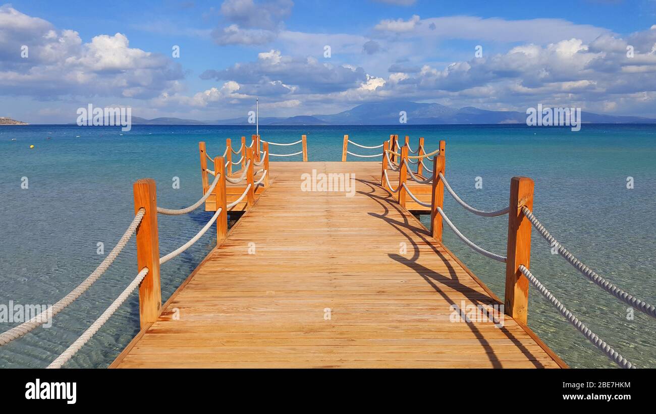 Tropical beach and pier in Cesme in Turkey Stock Photo - Alamy