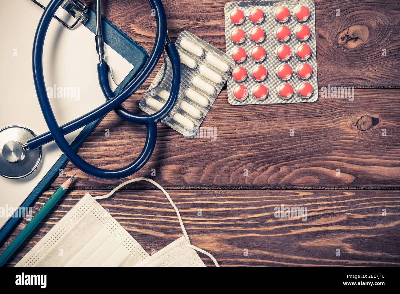 Desk of doctor with medicine things Stock Photo - Alamy