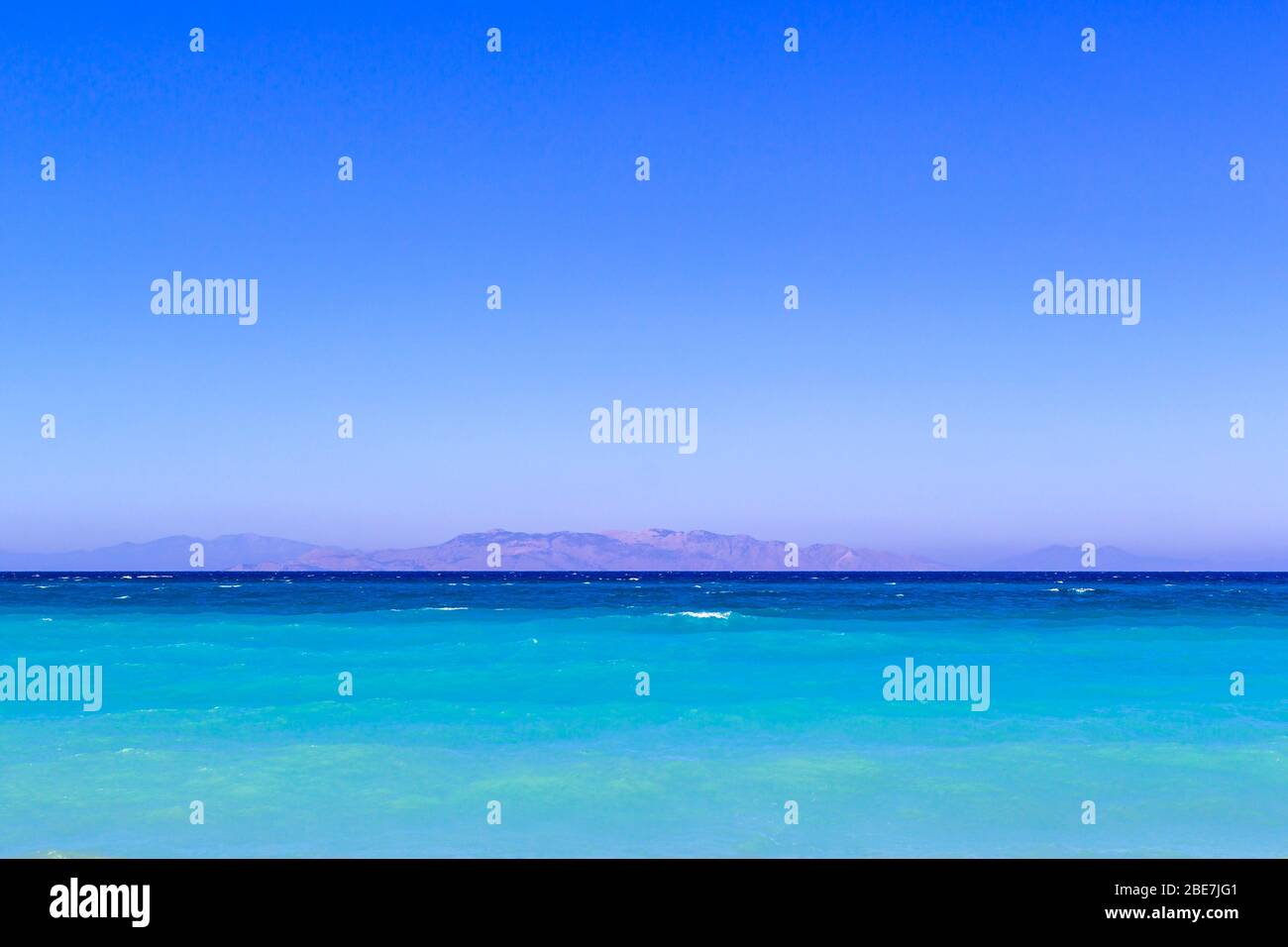 simply landscape with sea turquoise color , mountains on the horizon ...