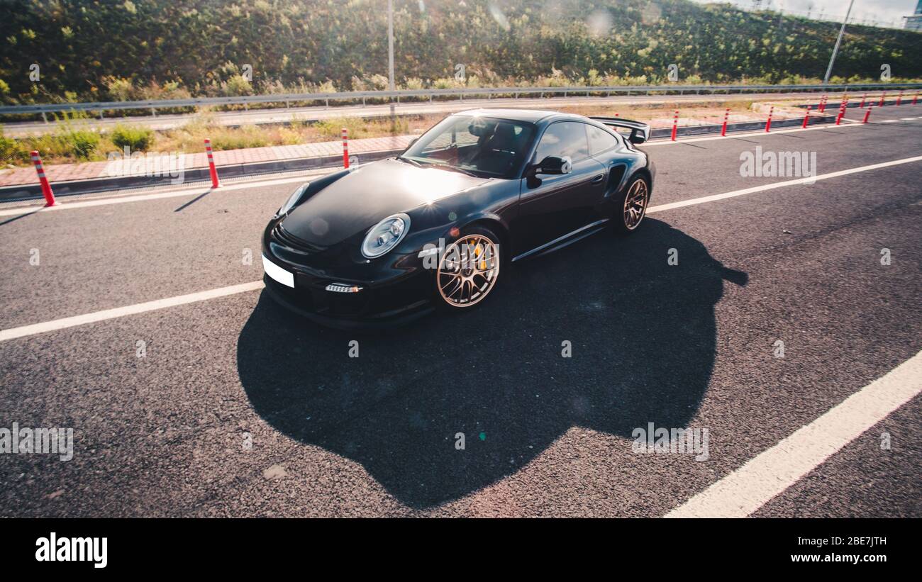 Blue brand sport model car speed test on the road, upside view Stock ...