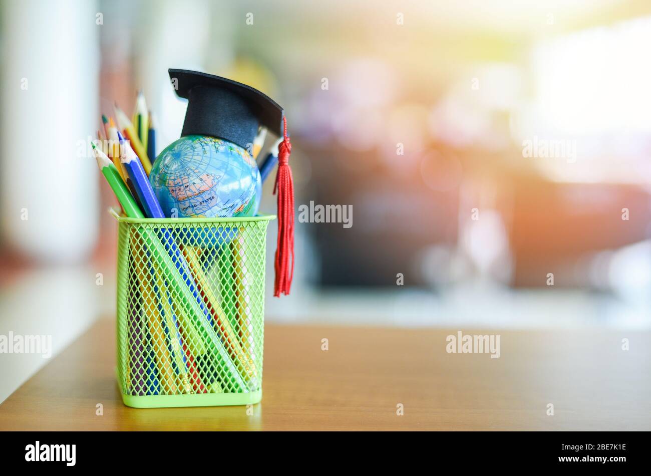 Graduation hat on earth globe model global education study concept ...