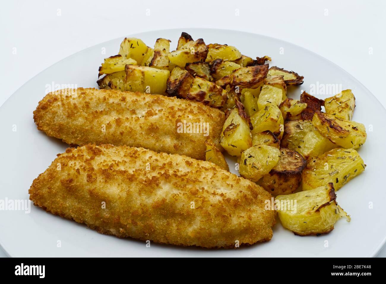 Cod fillet baked with potatoes isolated on white background Stock Photo ...