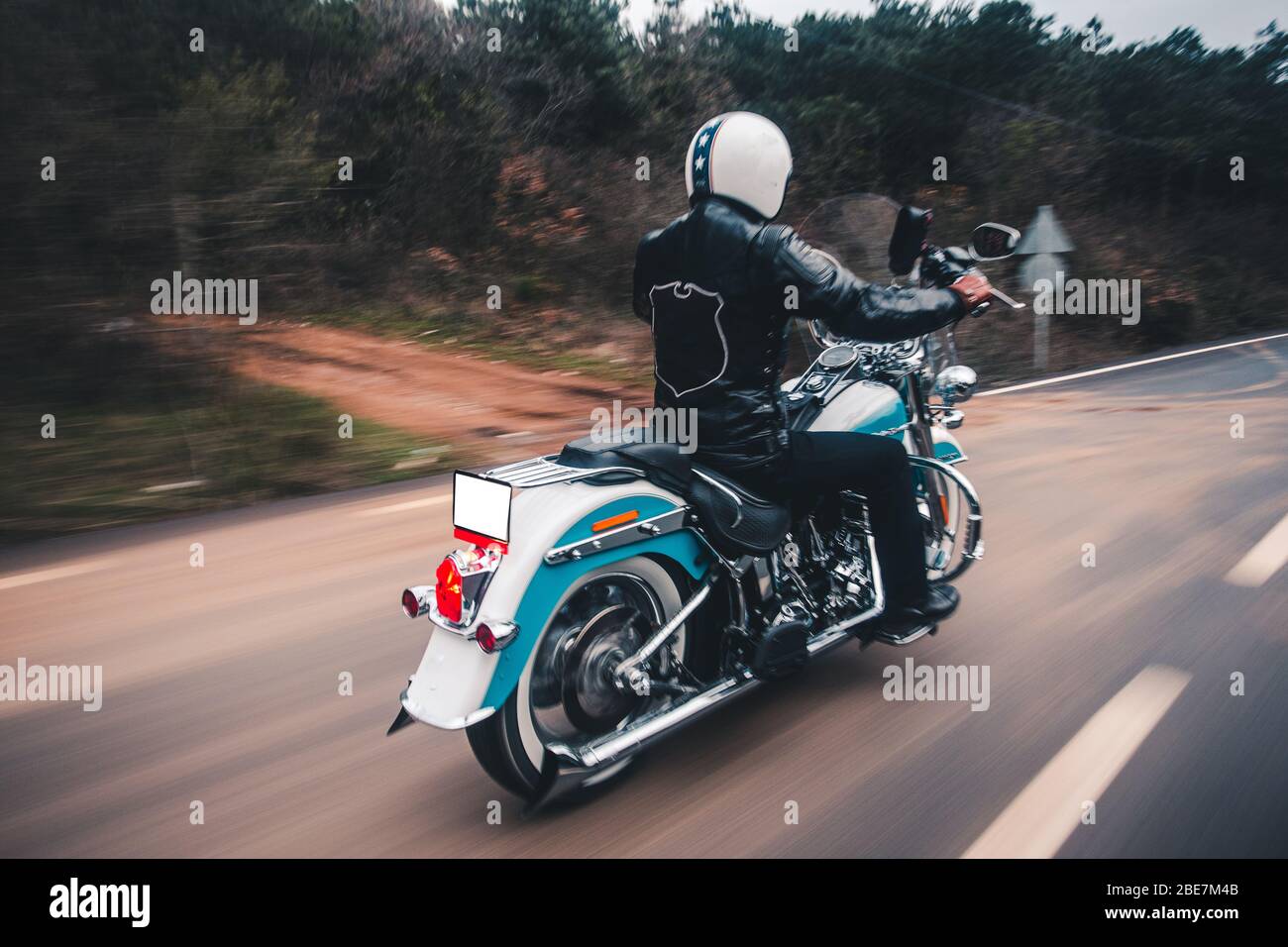 Driving blue motorcycle on the forest road Stock Photo - Alamy