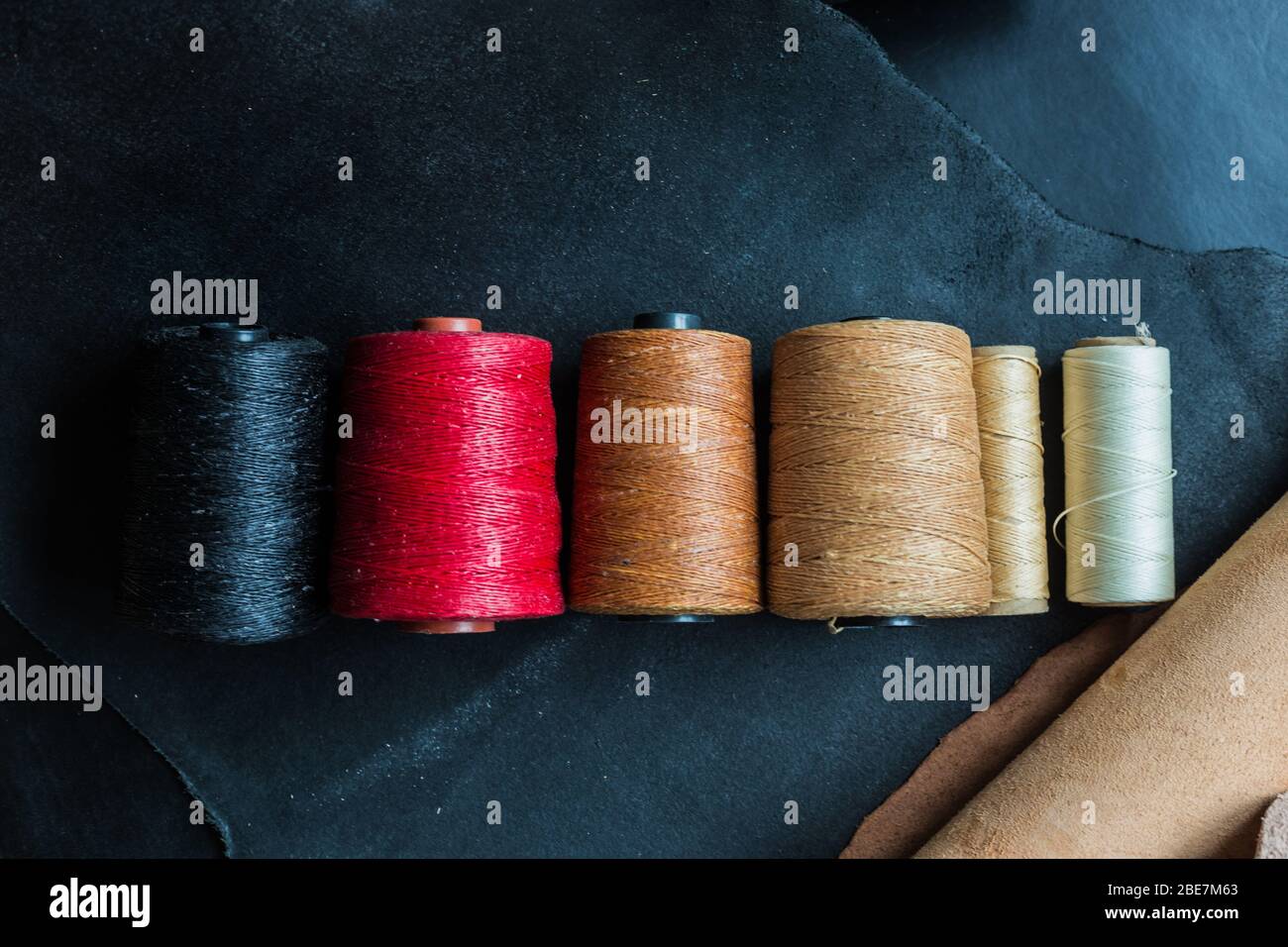 Wax color thread leather crafts woorking on wood background, Material ...