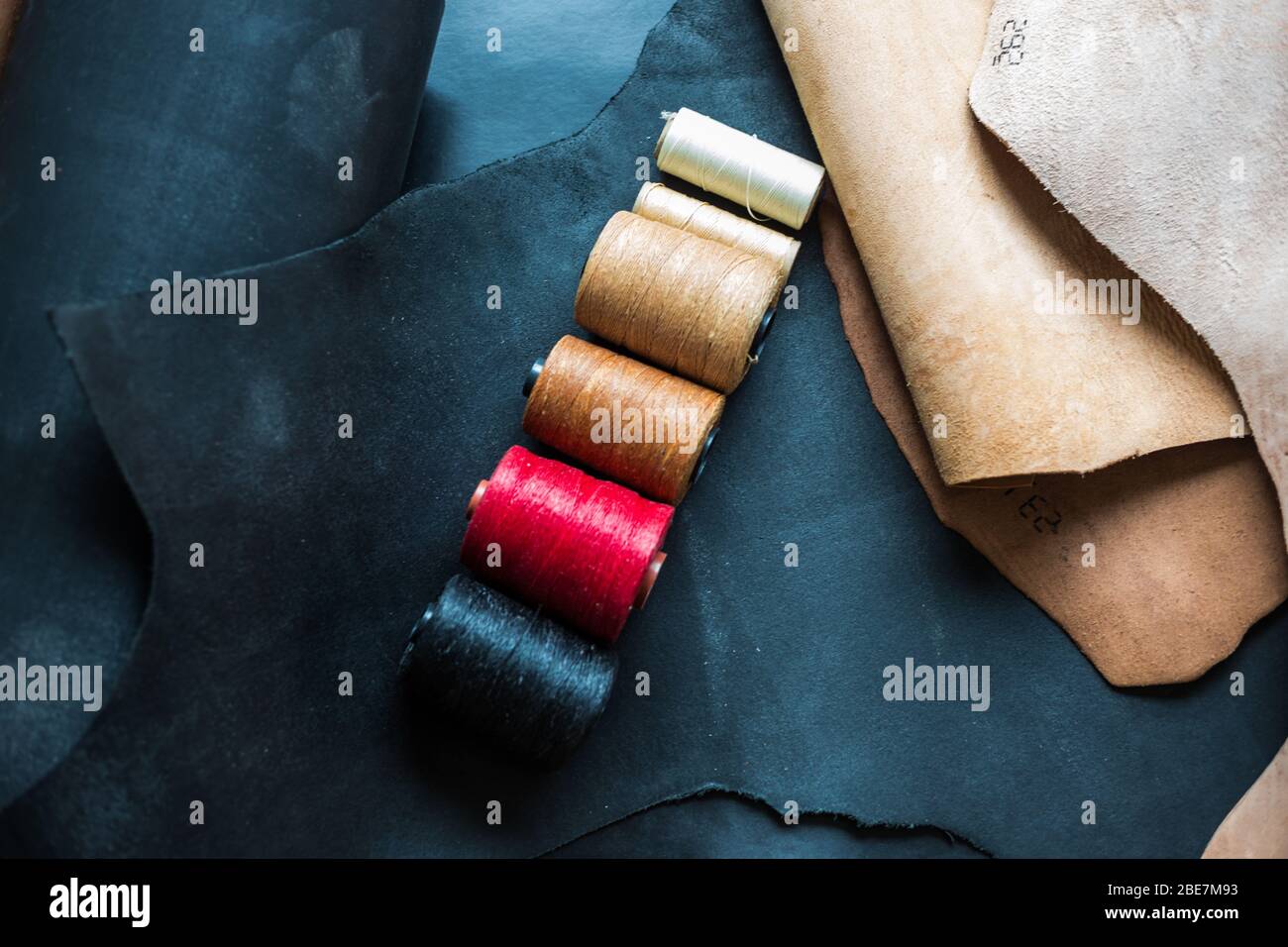 Wax color thread leather crafts woorking on wood background, Material ...