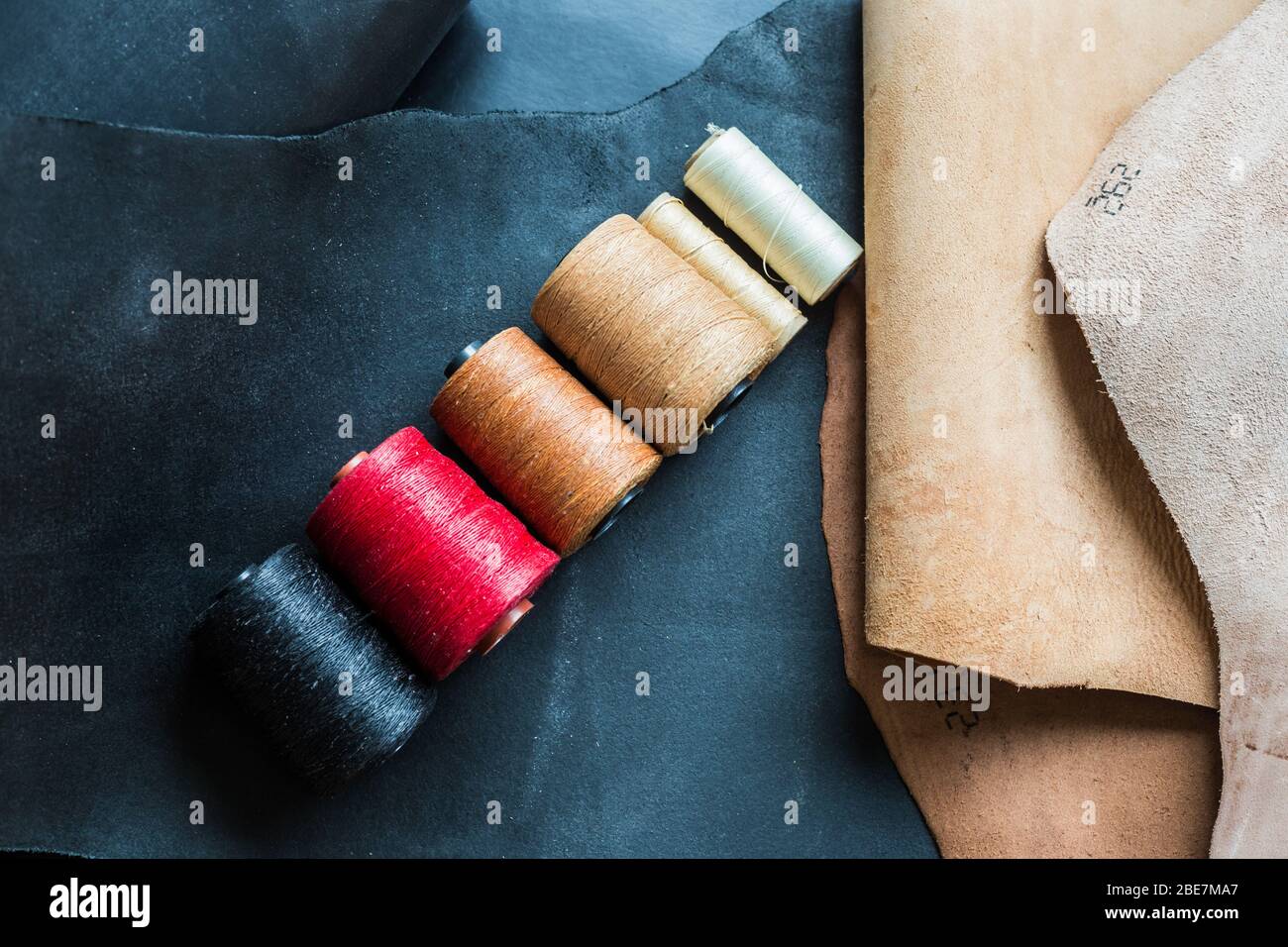 Wax color thread leather crafts woorking on wood background, Material ...
