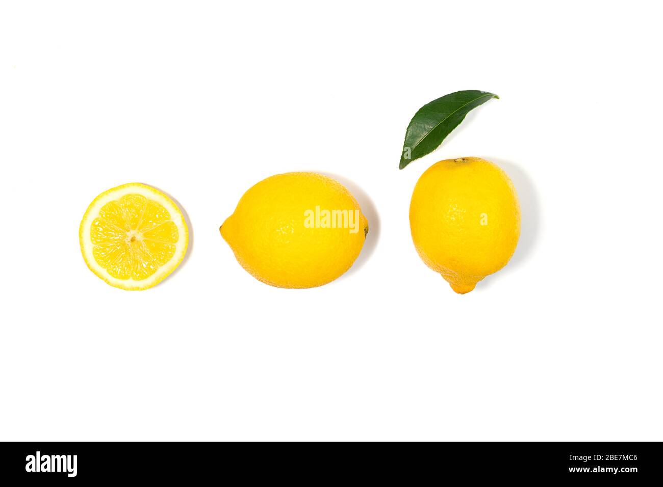 Creative layout made of lemon and green leaf. Flat lay. Food concept ...