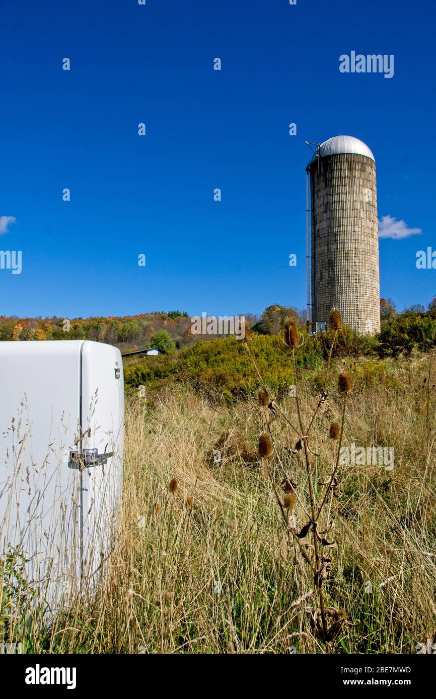 Old refrigerator in farm field Stock Photo - Alamy