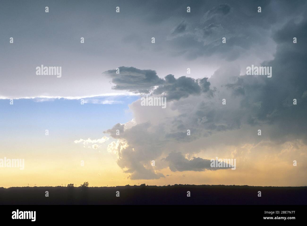 Left moving low precipitation supercell below the anvil of a much ...