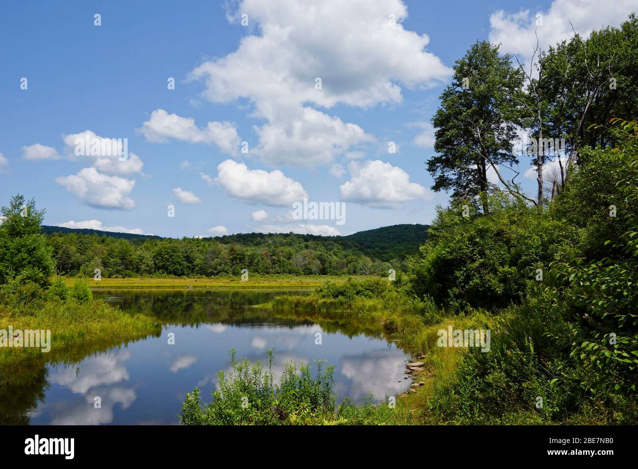 Clouds reflected in a lake in the Catskill Mountains in Upstate New ...