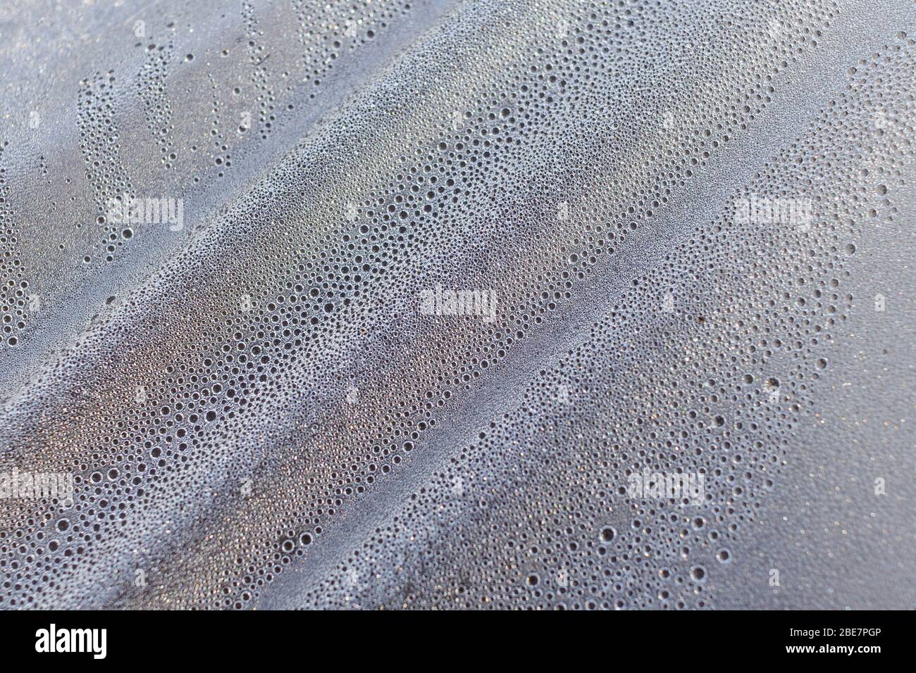 Background of the condensate drops on the film is polyethylene. Water ...