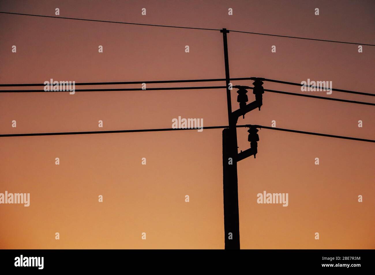 Silhouette electric pole and sunset, Beautiful red sunset sky behind ...