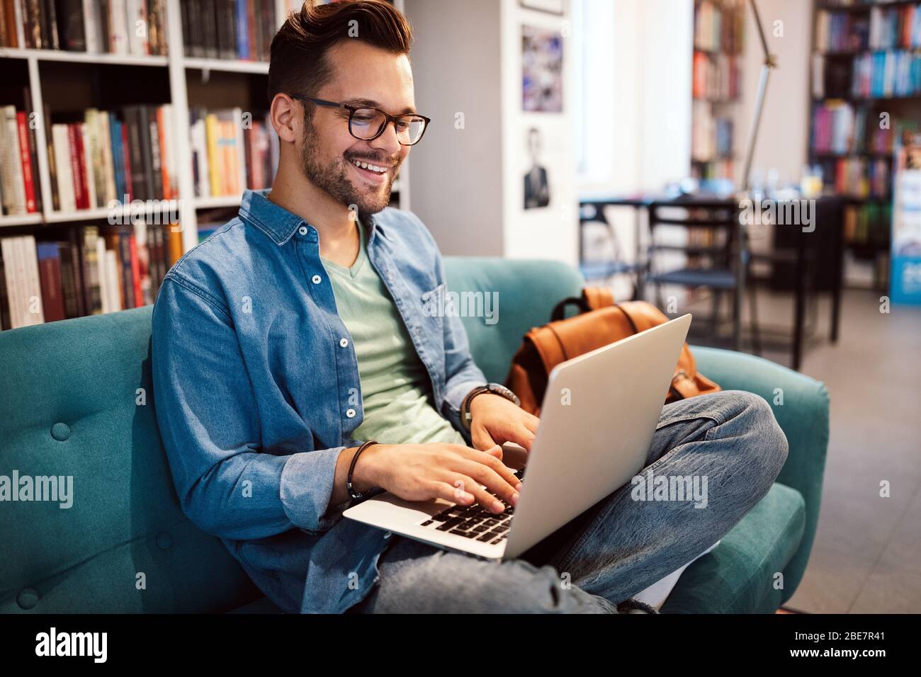 Student working laptop in library hi-res stock photography and images ...