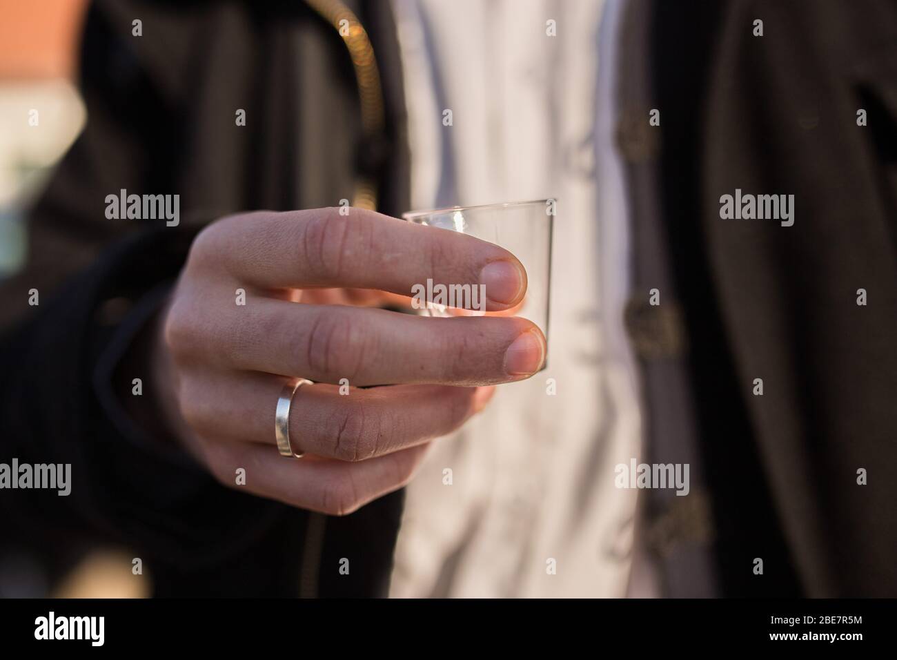 Holding a shot of "palinka" (traditional Hungarian spirit Stock Photo ...