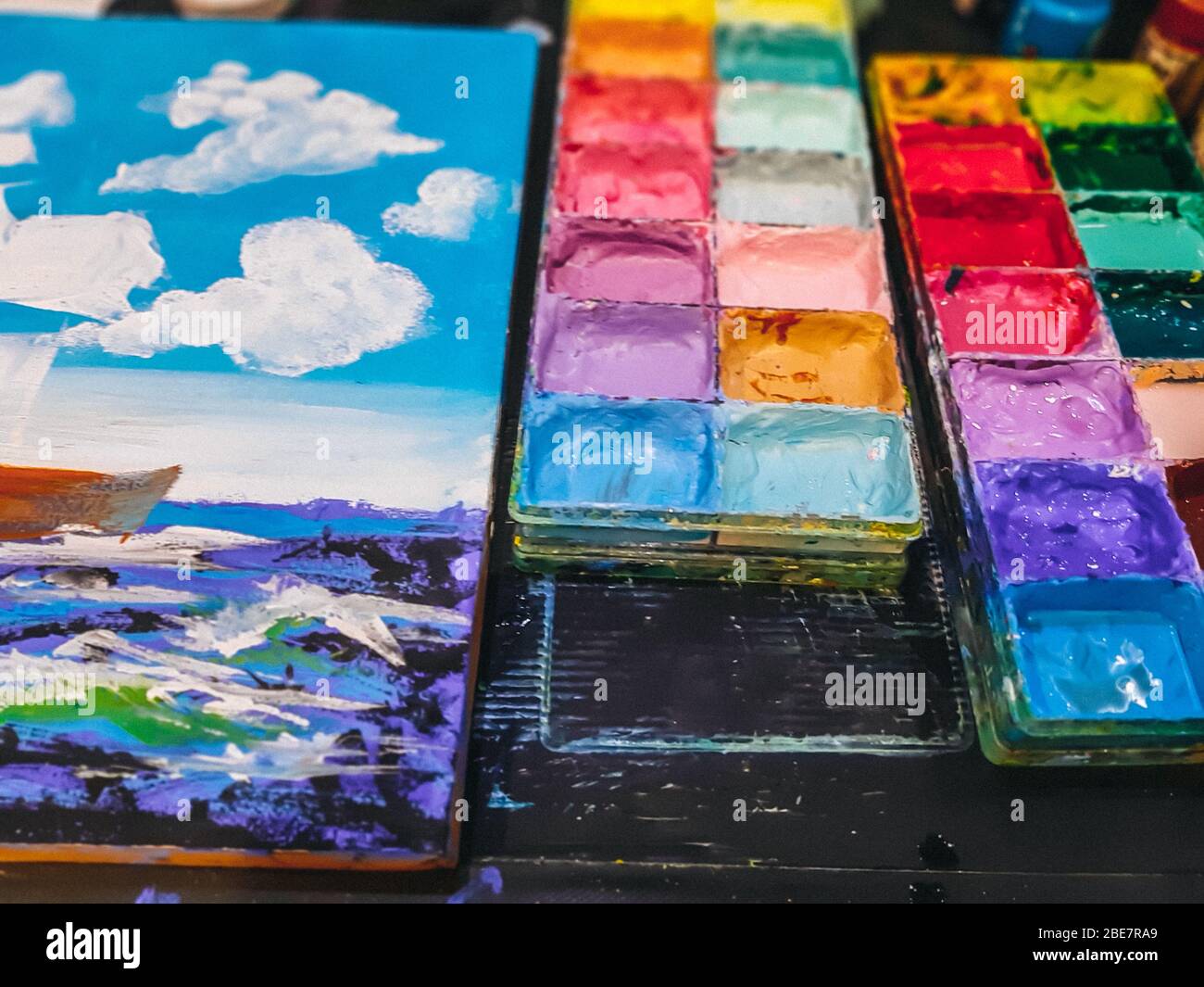 Watercolor in a palette, The palette water paints on the table, many ...