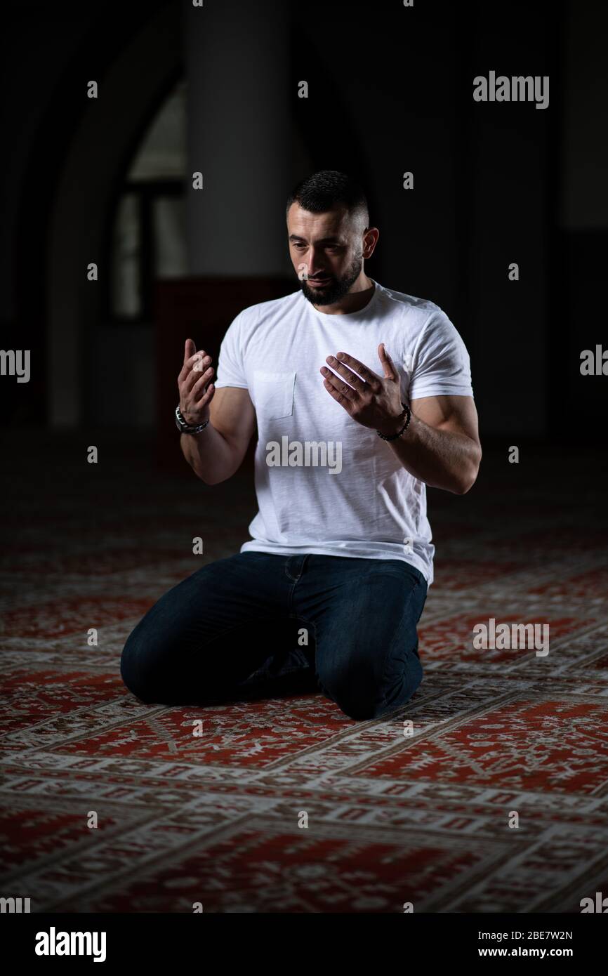 Portrait of a Young Muslim Man Making Traditional Prayer to God Allah ...