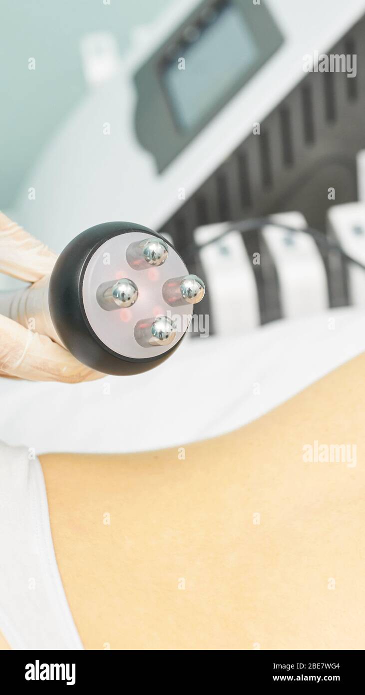 Perfect body radio treatment. Woman at spa procedure. Doctor hand and ...