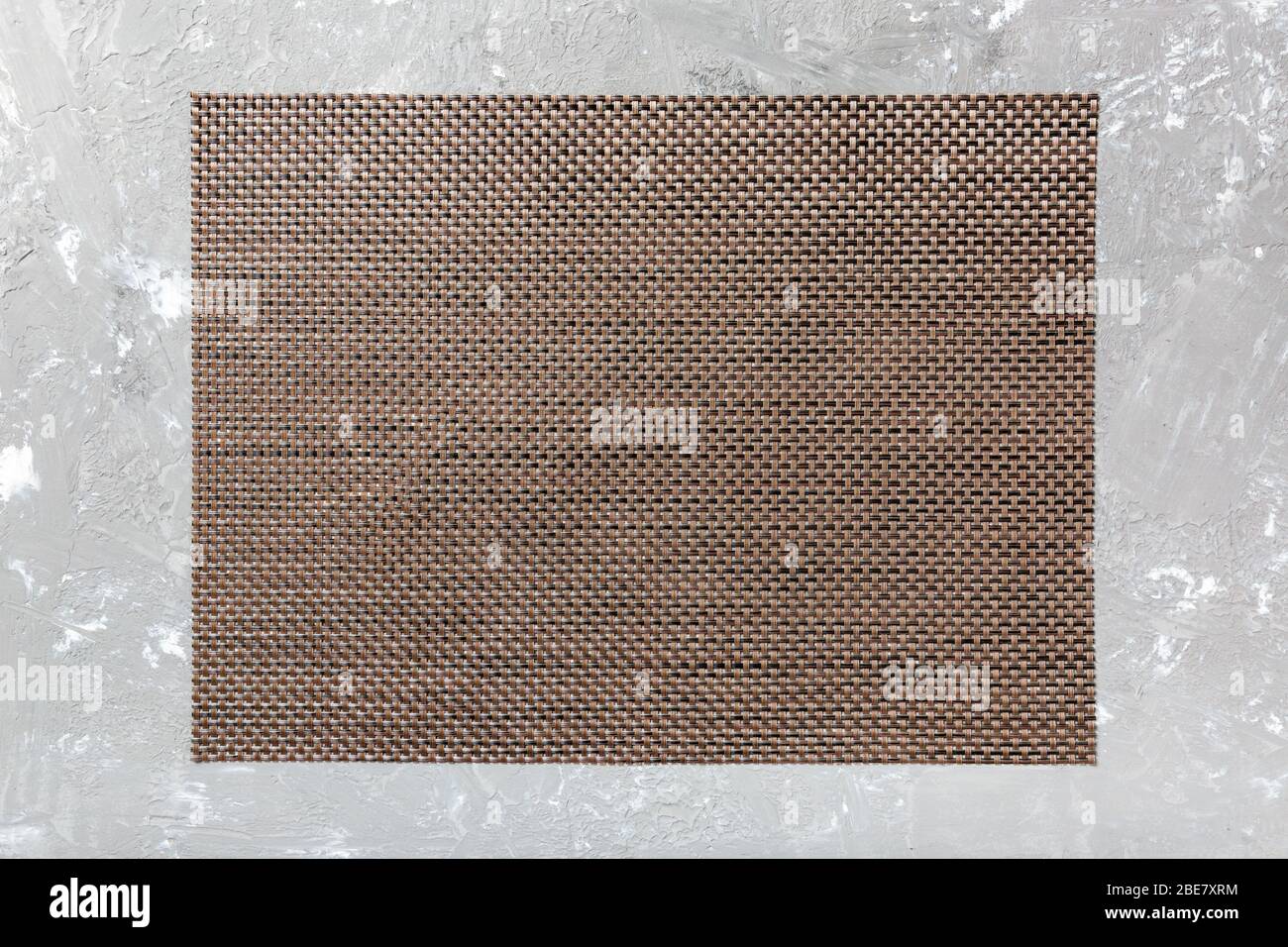 Top view of brown table napkin on cement background. Place mat with ...