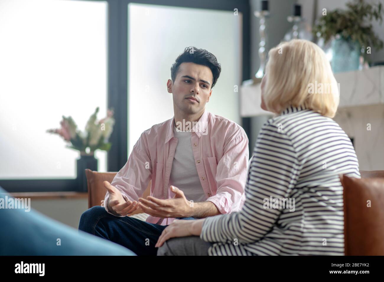 Suspicious young man in hi-res stock photography and images - Alamy