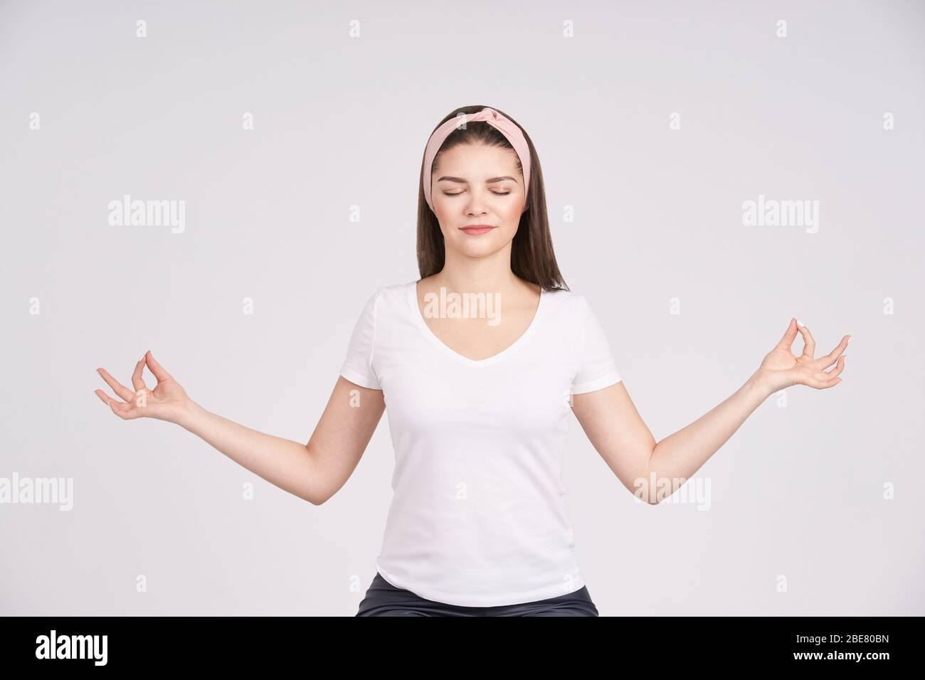 Young pretty girl in meditation position. Calm zen think. Hands balance ...