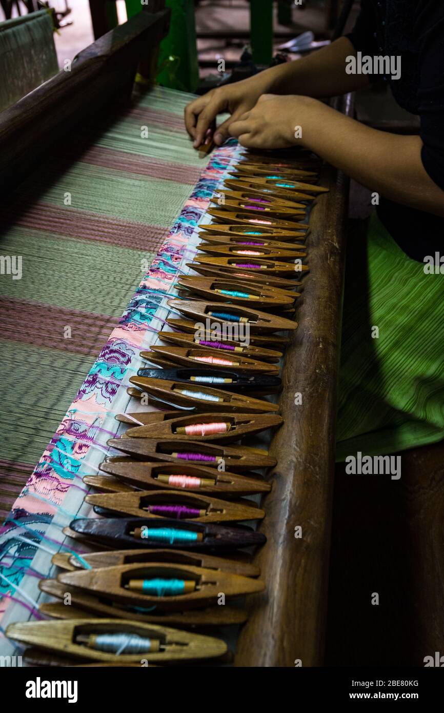 Weaving silk on a loom, Mandalay, Myanmar Stock Photo - Alamy