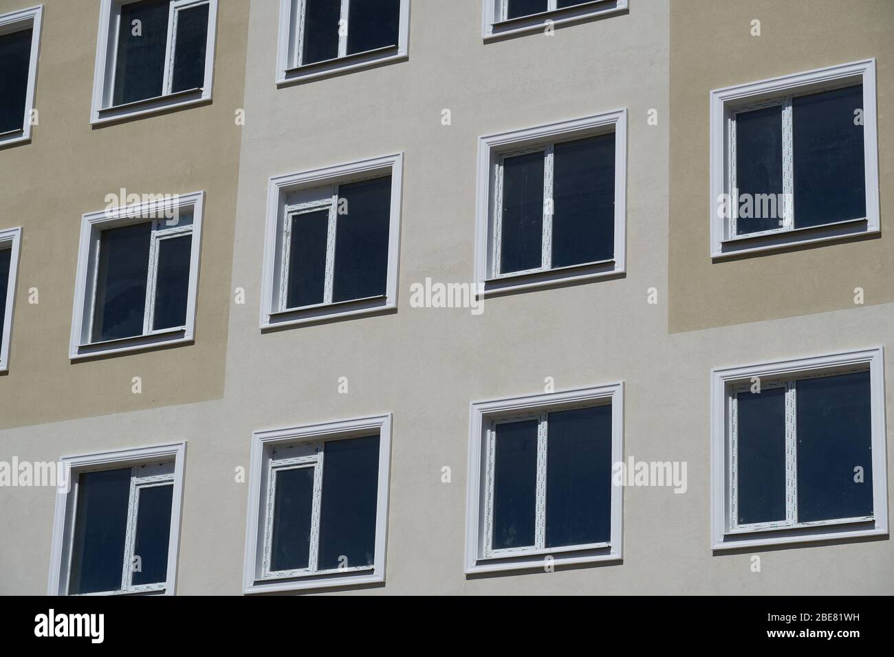 facade of a new multi-storey building with many windows Stock Photo - Alamy