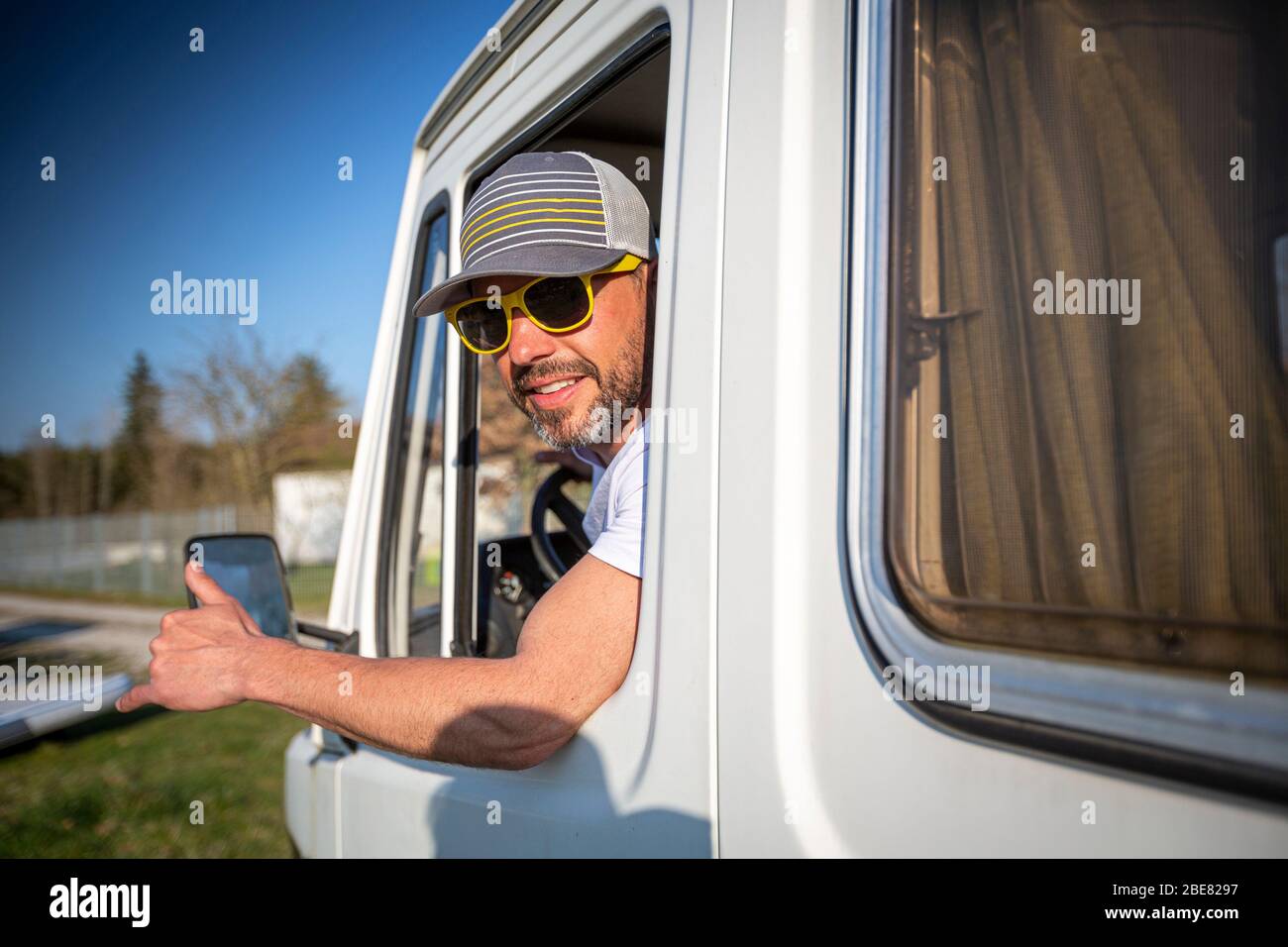 Portrait of careless man during holidays camping in his van Stock Photo ...