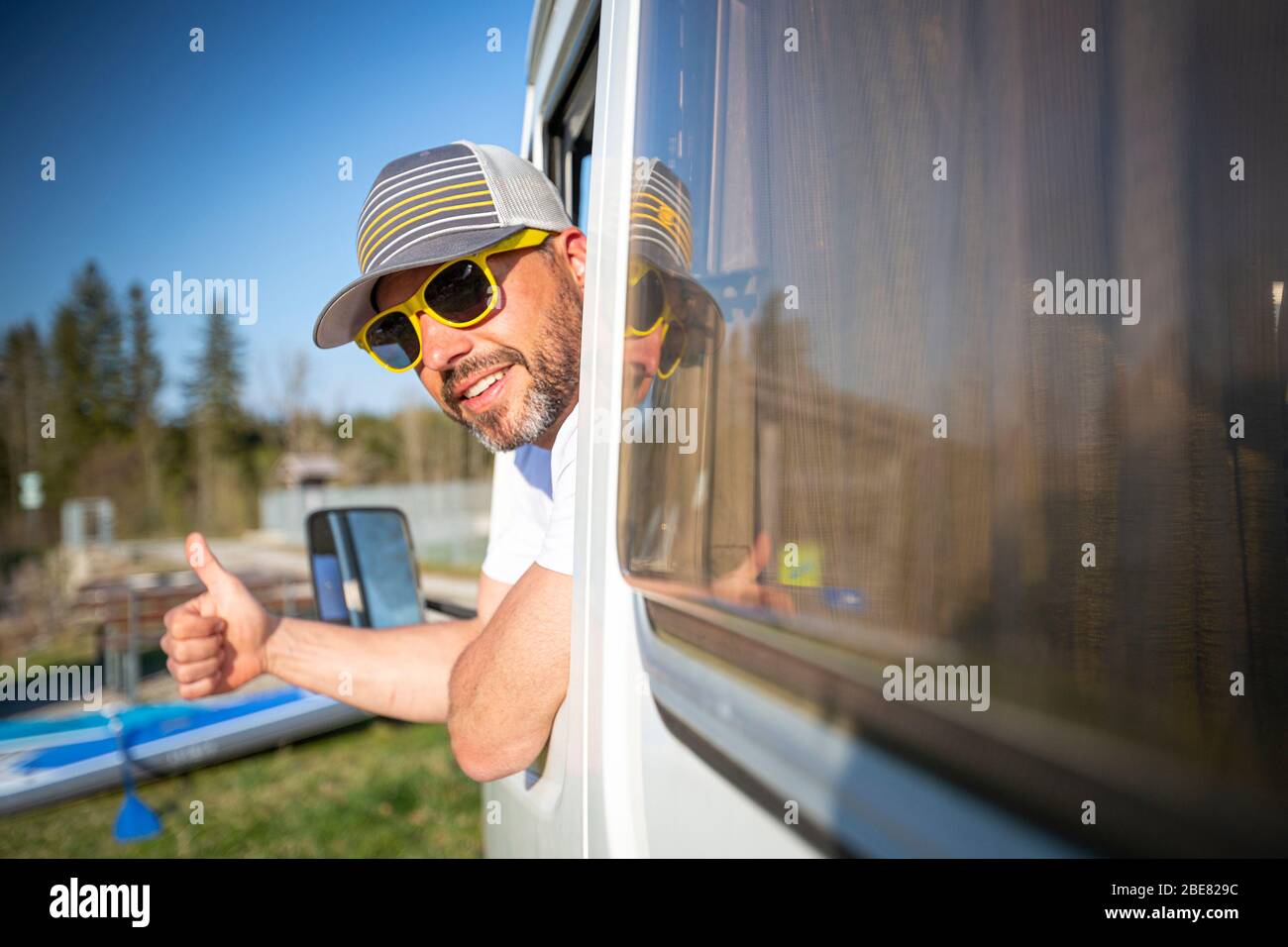 Portrait of careless man during holidays camping in his van Stock Photo ...